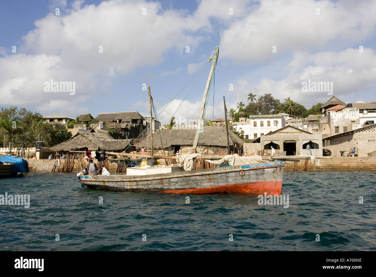 Arabian dhow moored by waterfront of Lamu Island Kenya East Africa ...