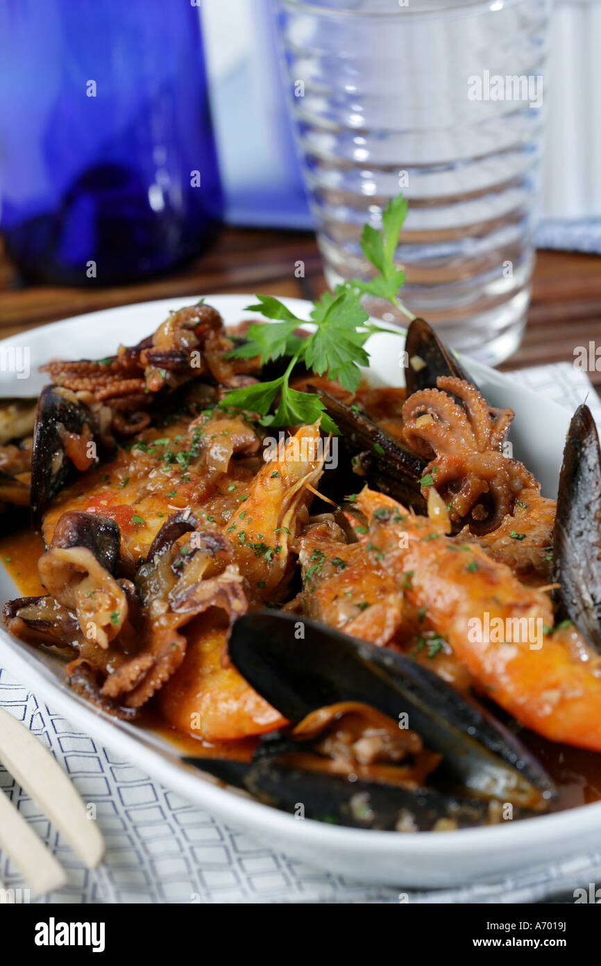 Grouper and seafood casserole Stock Photo - Alamy