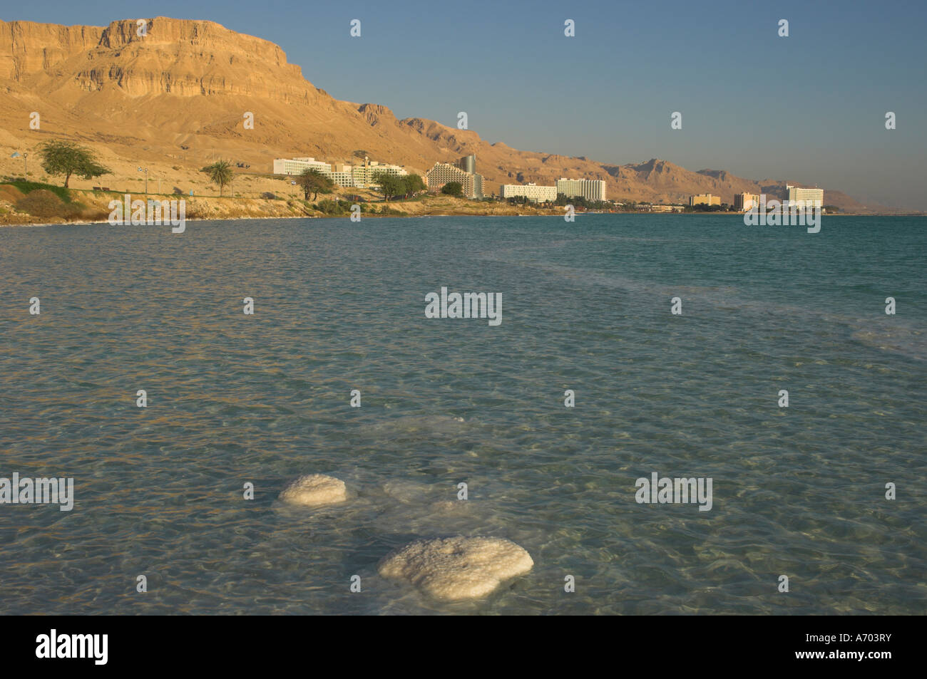 Salt blocks in the sea and hotels in background Ein Bokek Hotel Resort Dead Sea Israel Middle ...