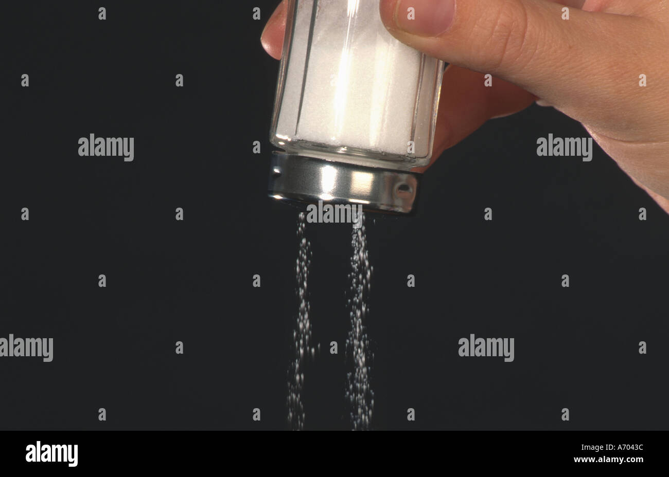 food spice salt hand with a saltshaker Stock Photo - Alamy