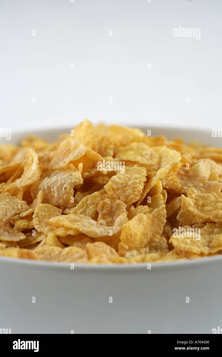 Corn flakes in a bowl for breakfast close up white background Stock ...
