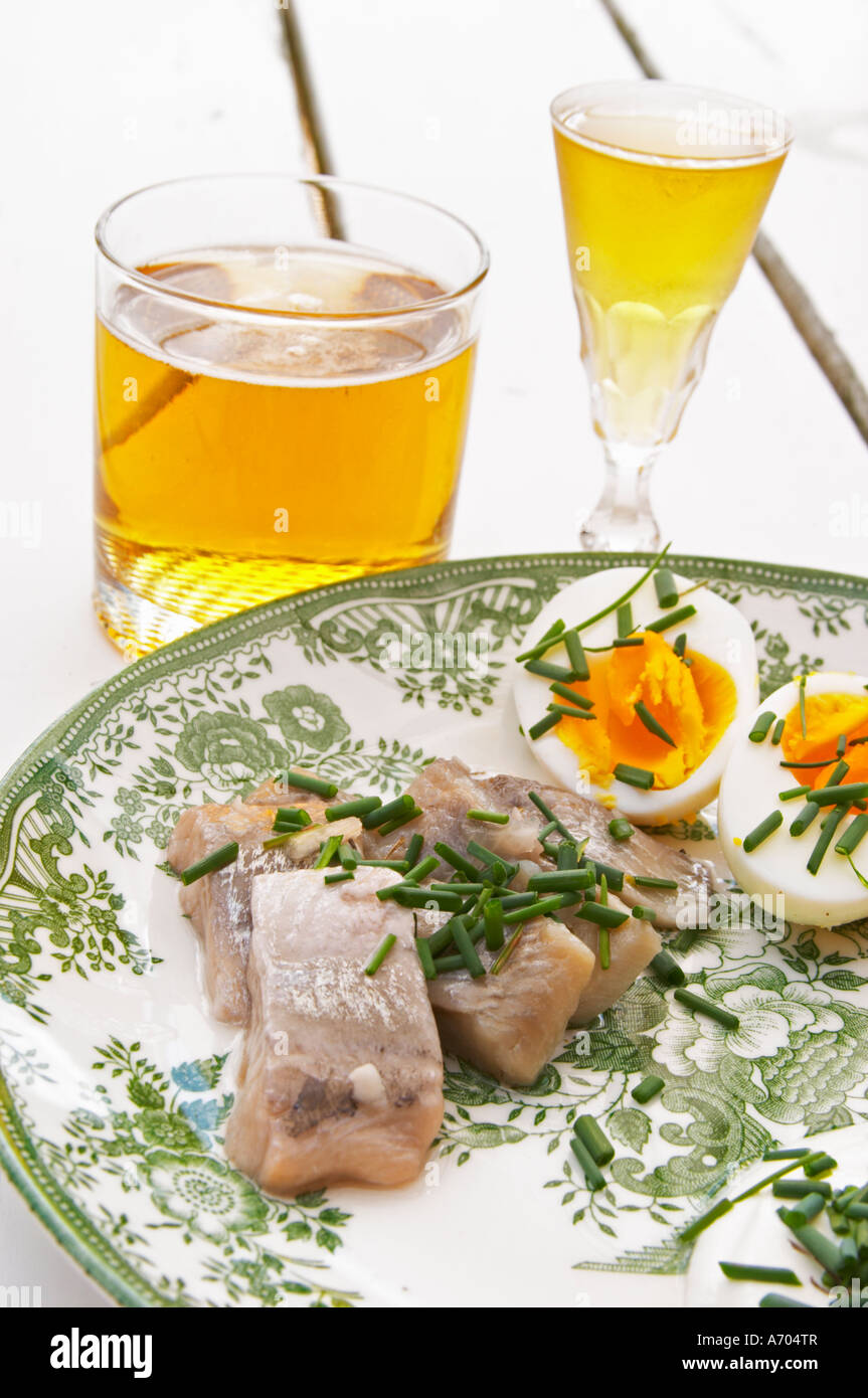 Traditional Swedish summer lunch with marinated herring sill, boiled ...
