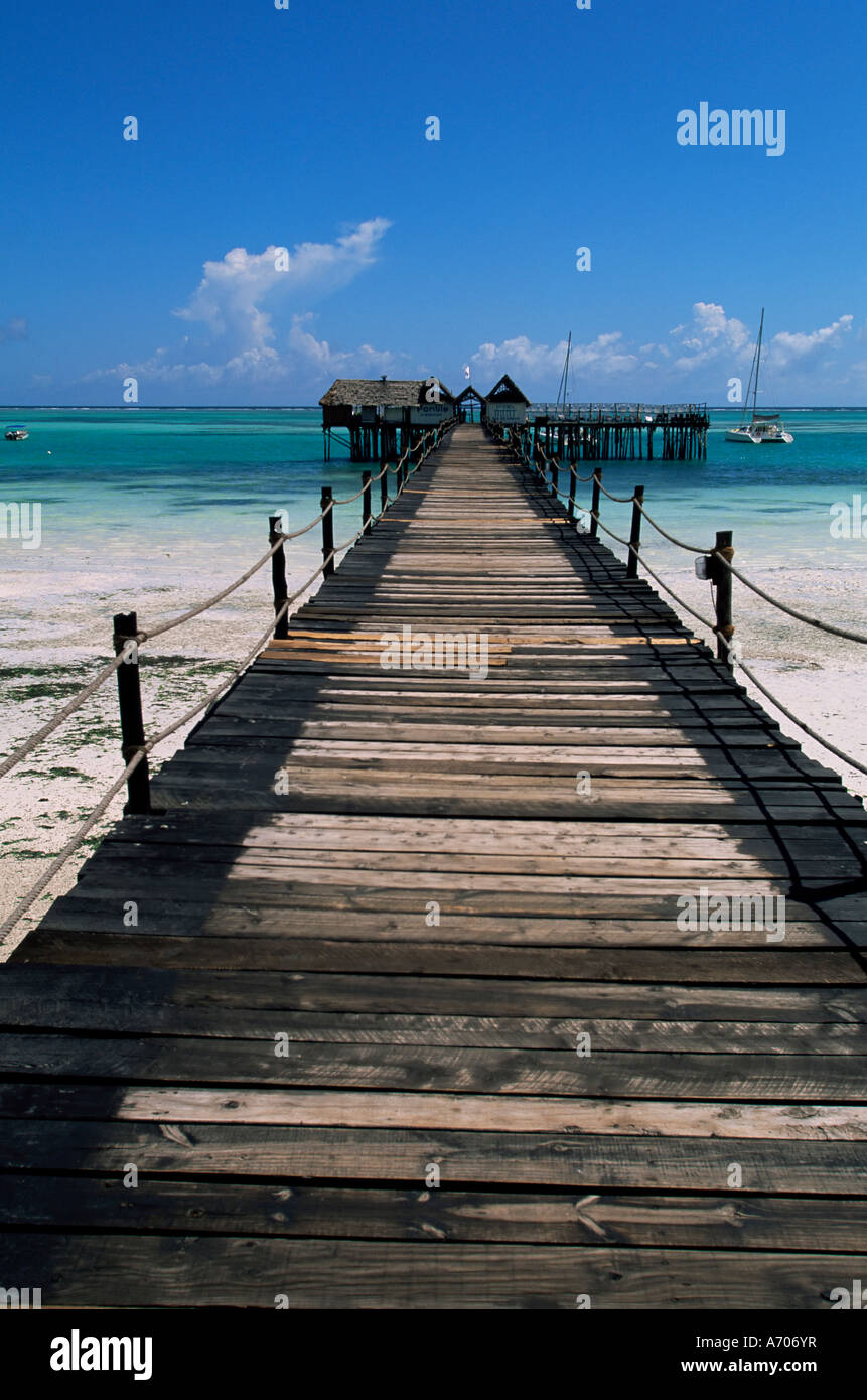Bridge leading to a bar on the water Kiwengwa beach Zanzibar Tanzania ...