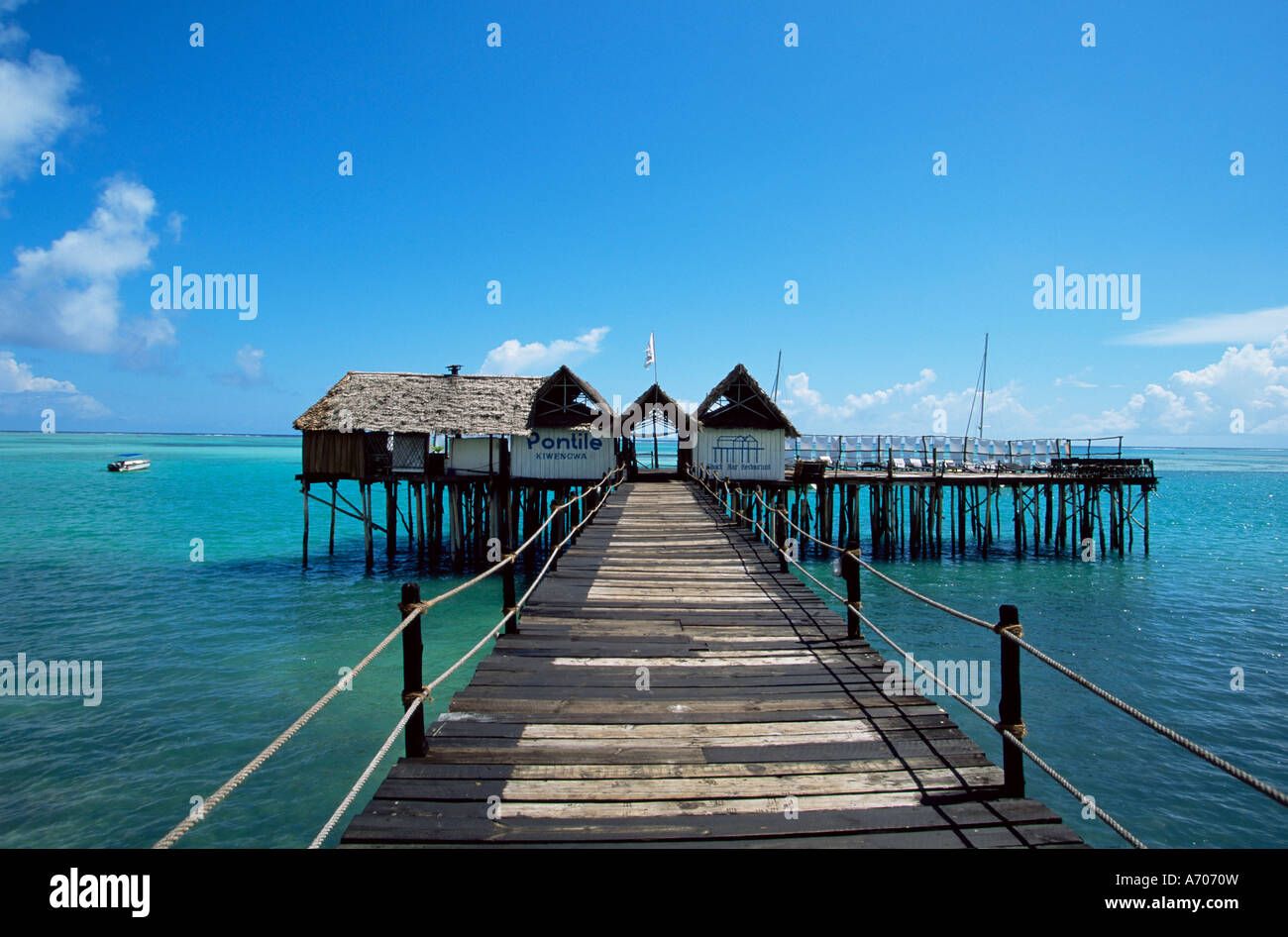 Bridge leading to a bar on the water Kiwengwa beach Zanzibar Tanzania ...