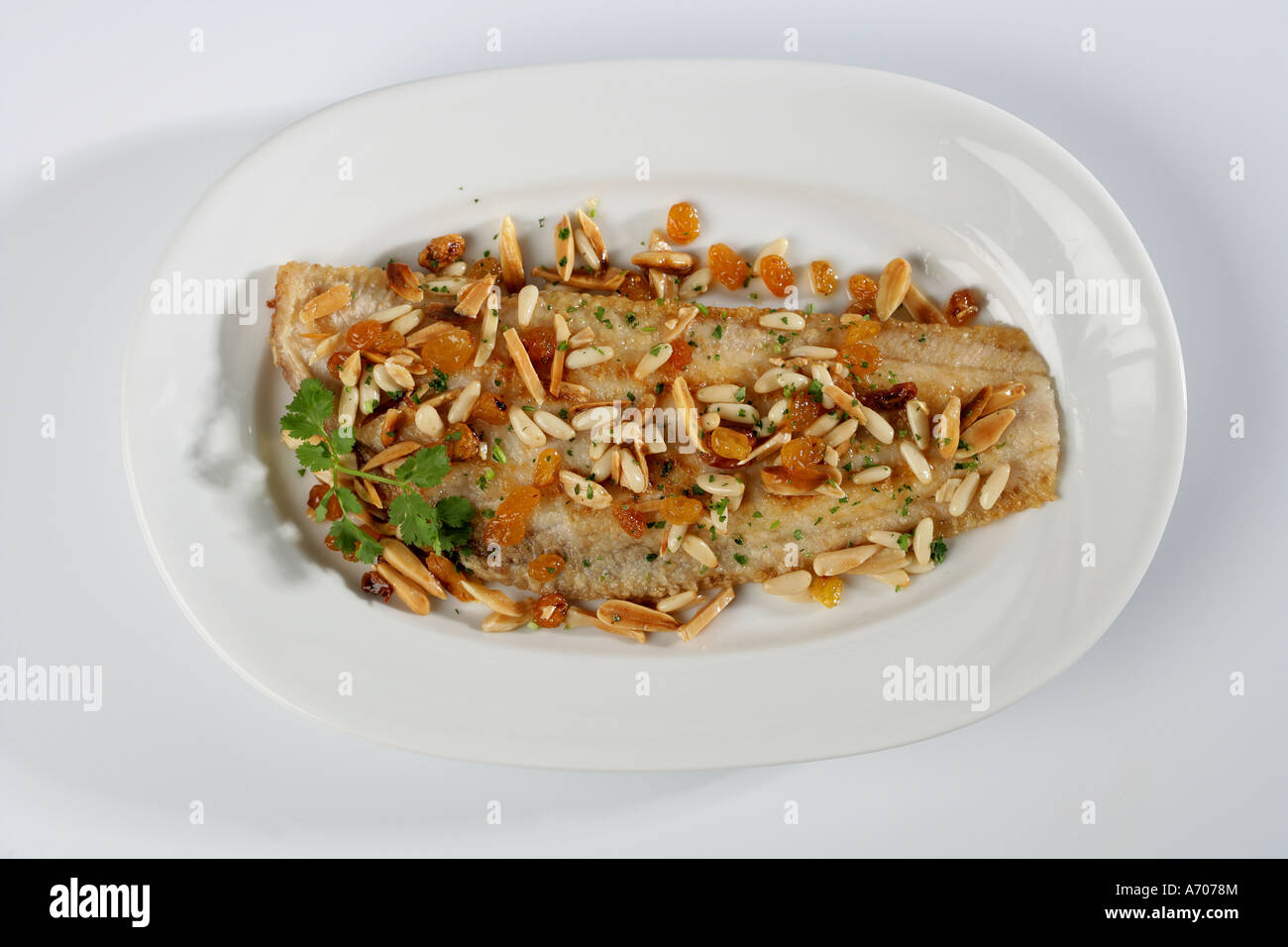 Sole fish with nuts zenithal view Stock Photo - Alamy