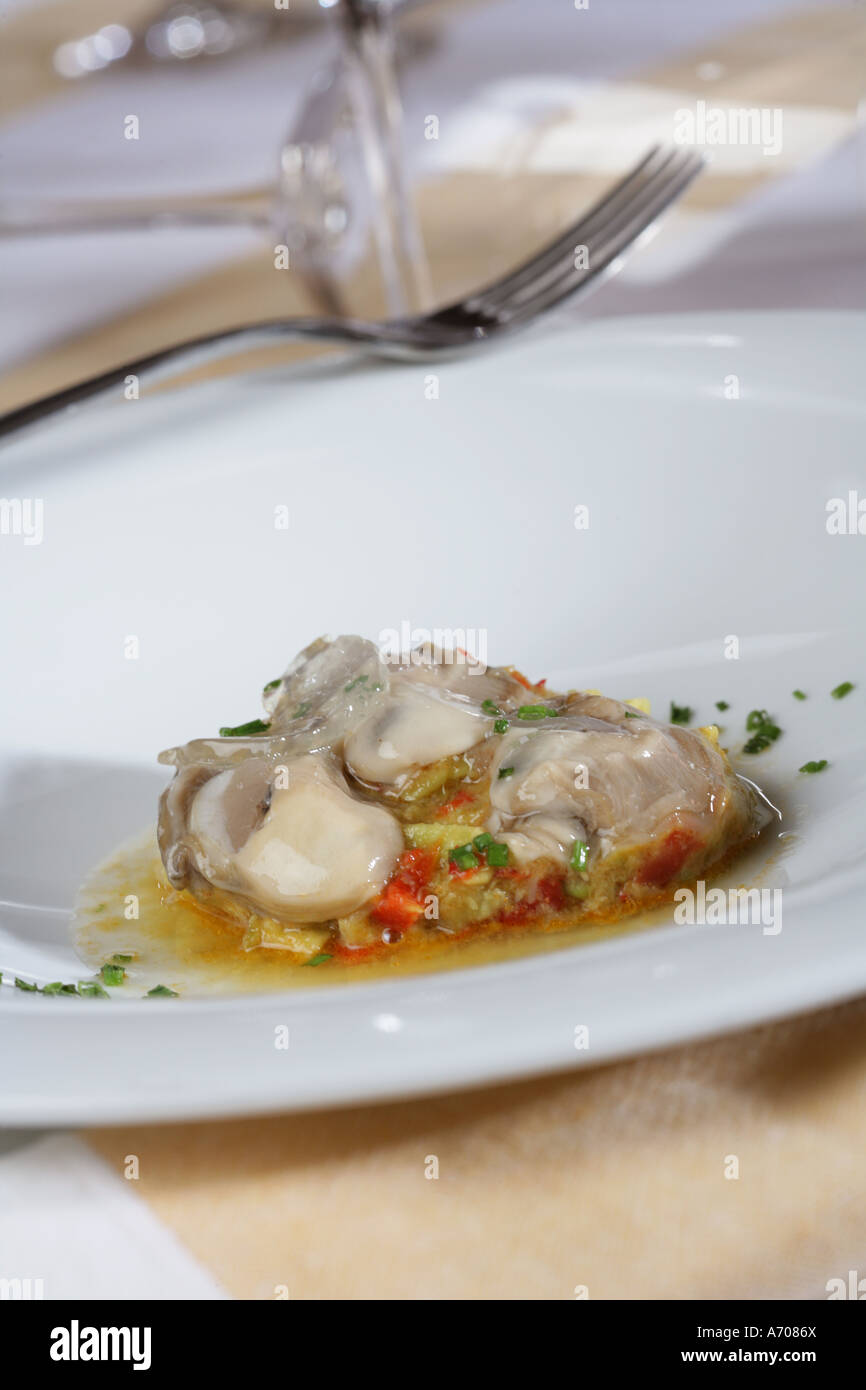 Oysters on spider crab tartare with prawns and hot leek cream Stock ...