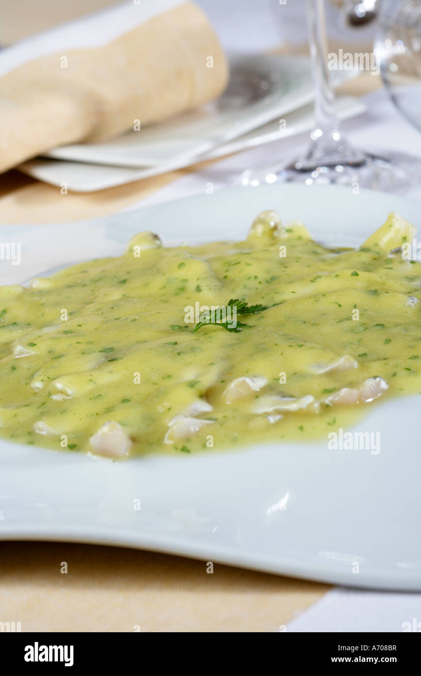 Cantabrian hake cheek coated in breadcrumbs with pil pil sauce Stock ...