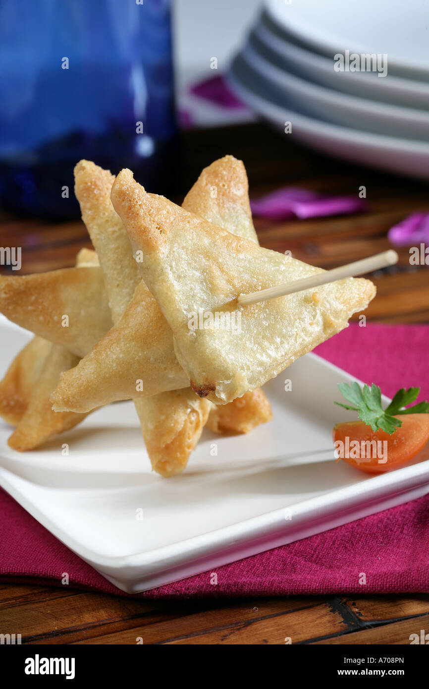 Salmon and cheese samosas brochettes Stock Photo - Alamy