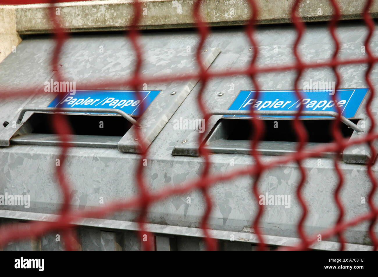Container for the disposal of paper and cardboard behind red bars, Herten, NRW, Nordrhein ...
