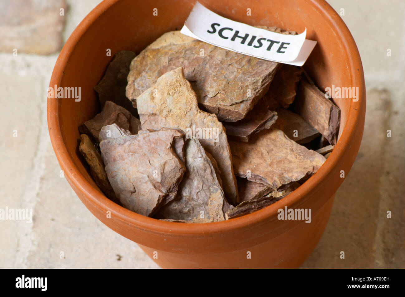 Plant pot with soil sample to illustrate different soil types, part of ...