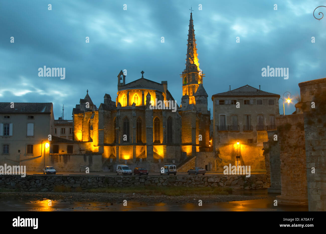 The gothic St Martin Church and the bridge across the l'Aude river ...