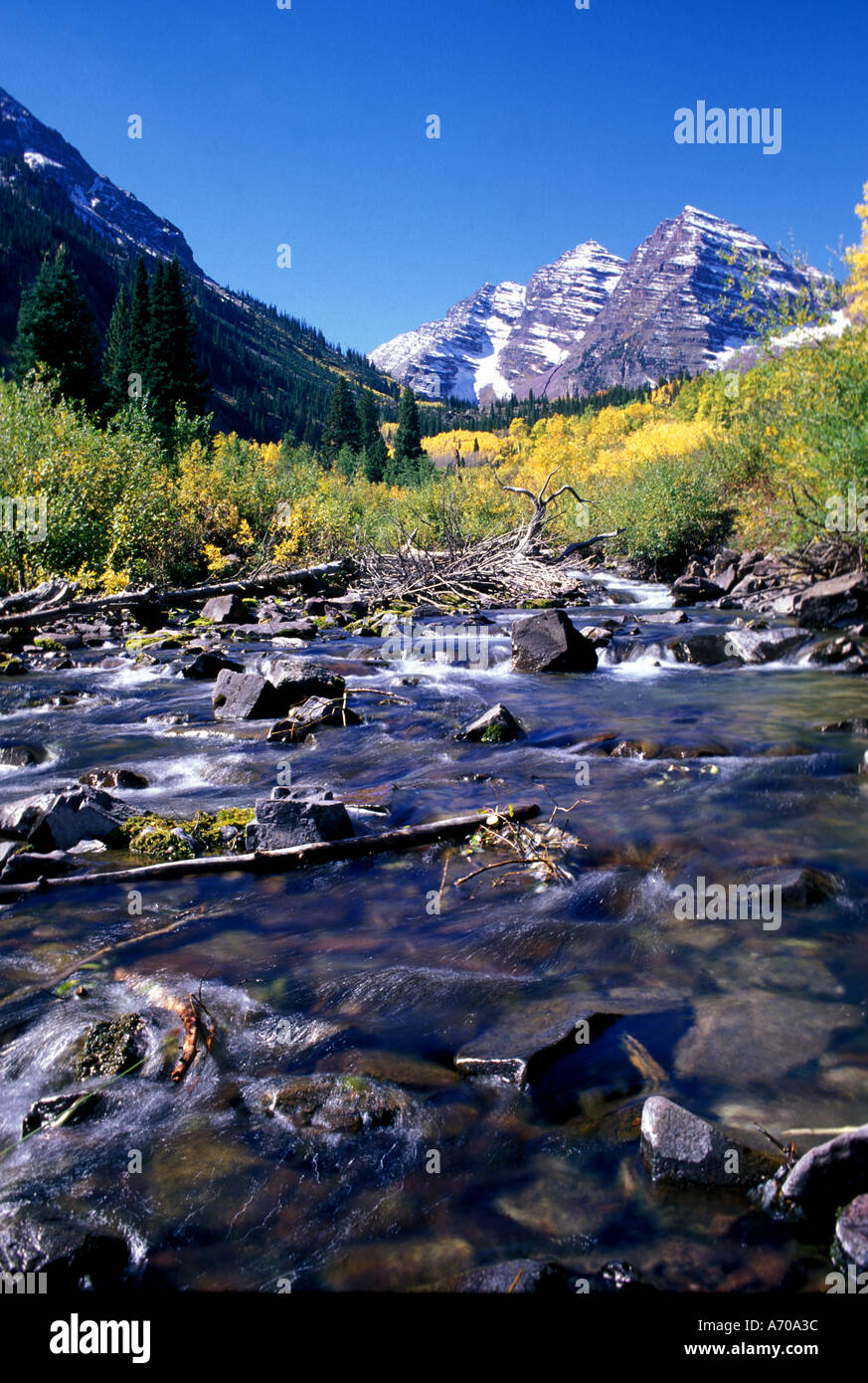 Maroon bells and creek with fall colors Stock Photo - Alamy