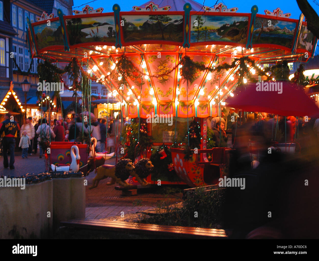 Roundabout and stands by a Christmas fair Stock Photo - Alamy