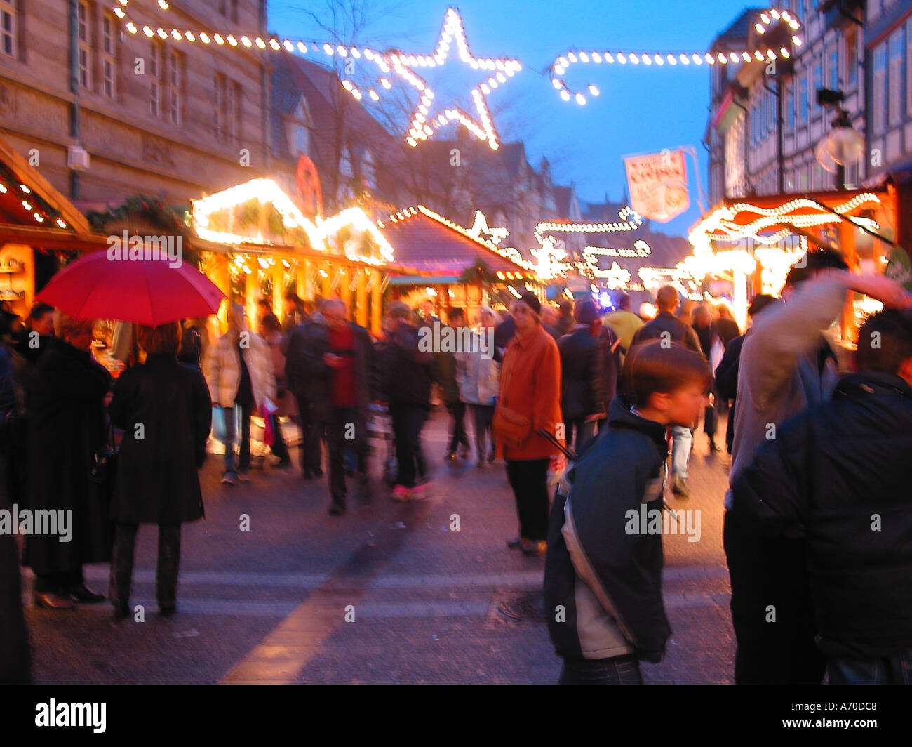 Roundabout and stands by a Christmas fair Stock Photo - Alamy