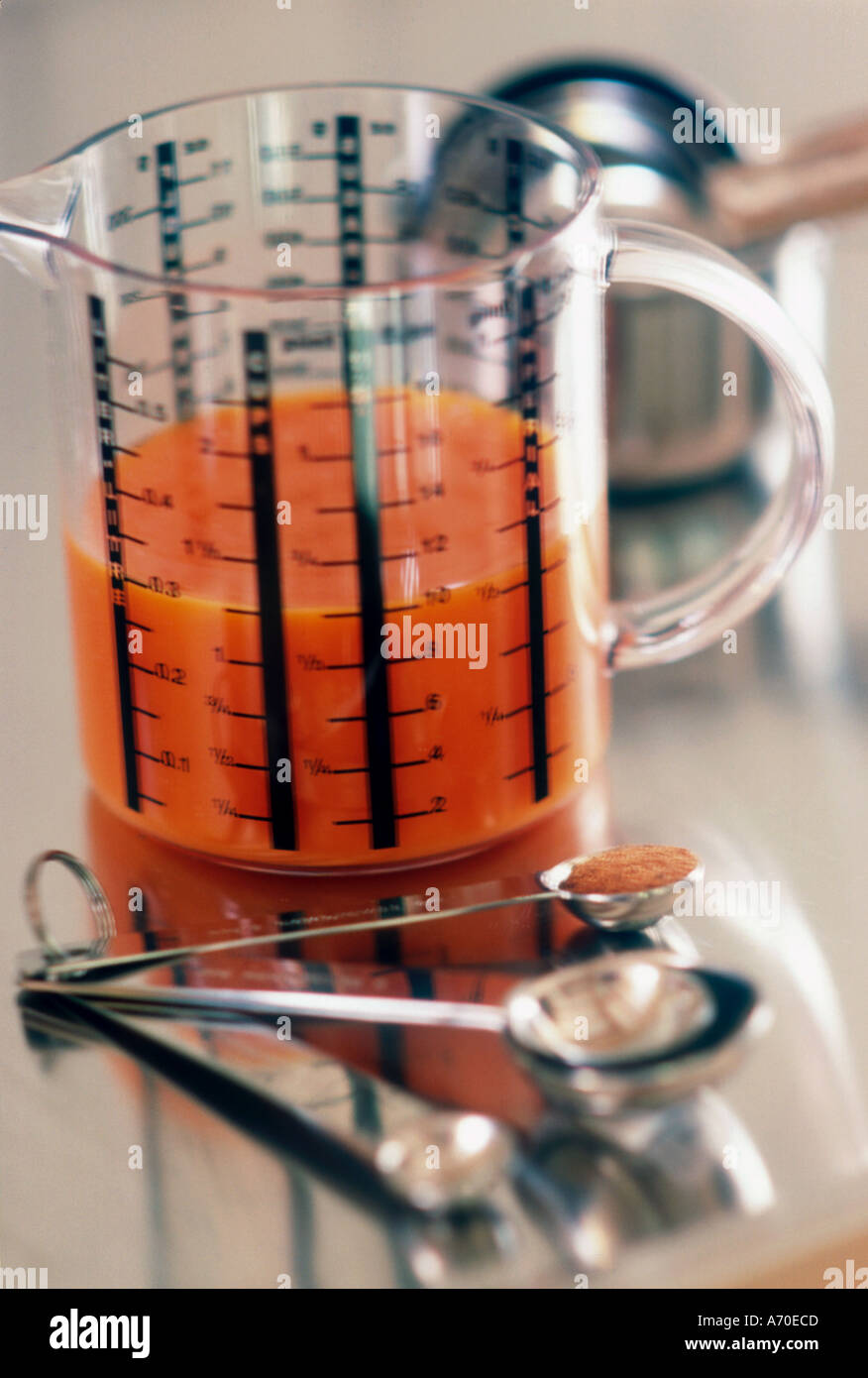 Measuring jug and measuring spoons in kitchen Stock Photo - Alamy