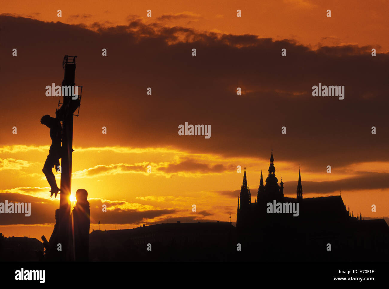 Crucifixion statue and St Vitus Cathedral on skyline of Prague Czech ...