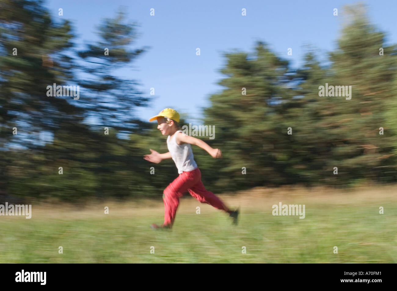Six year old boy running with outstretched arms Stock Photo - Alamy