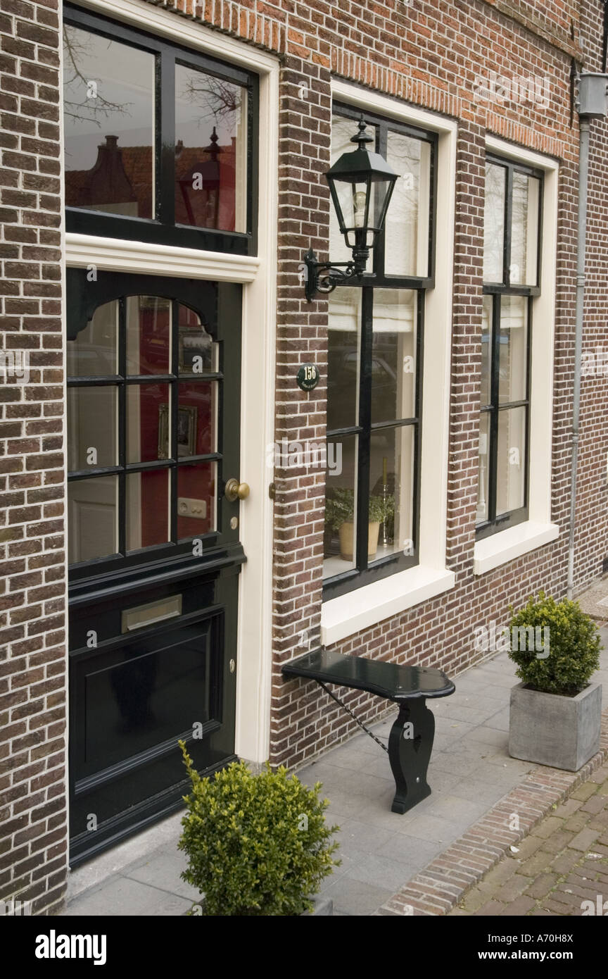 Lantern door windows and brick facade of typical Dutch apartment house ...