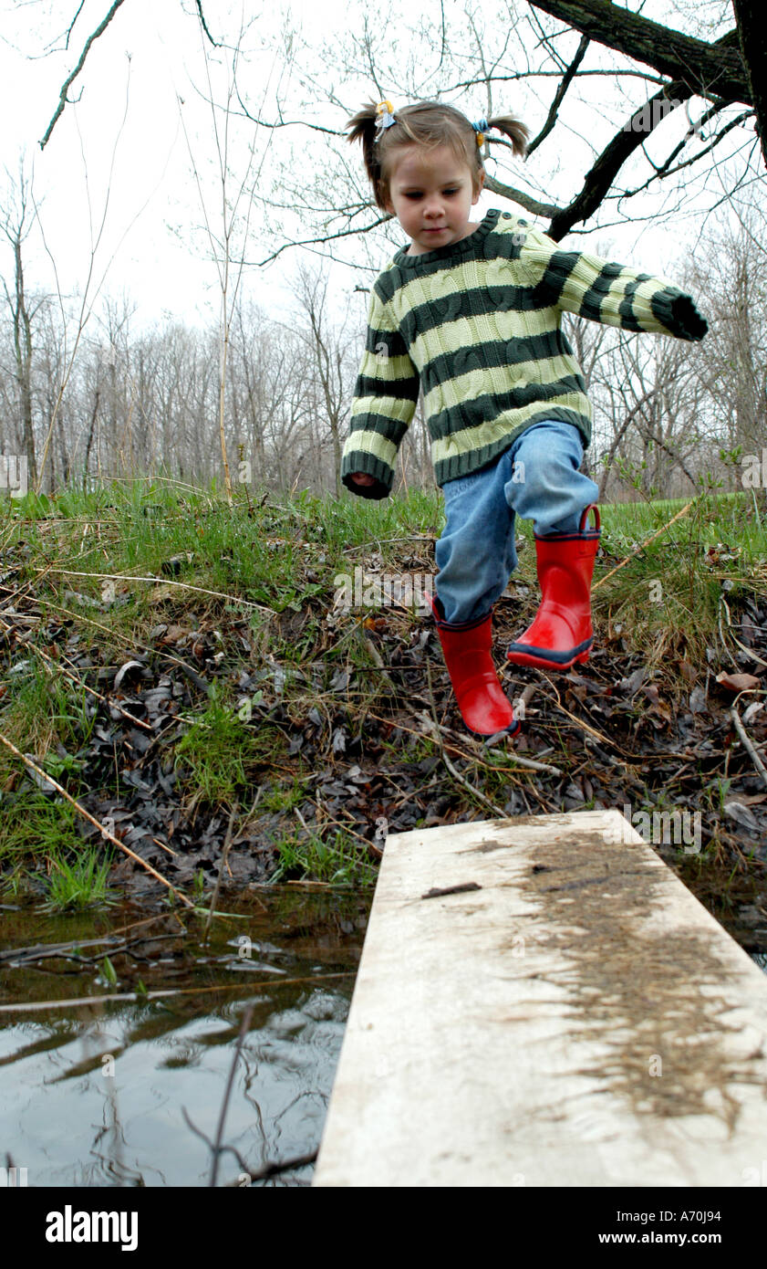 Child crossing bridge Stock Photo - Alamy