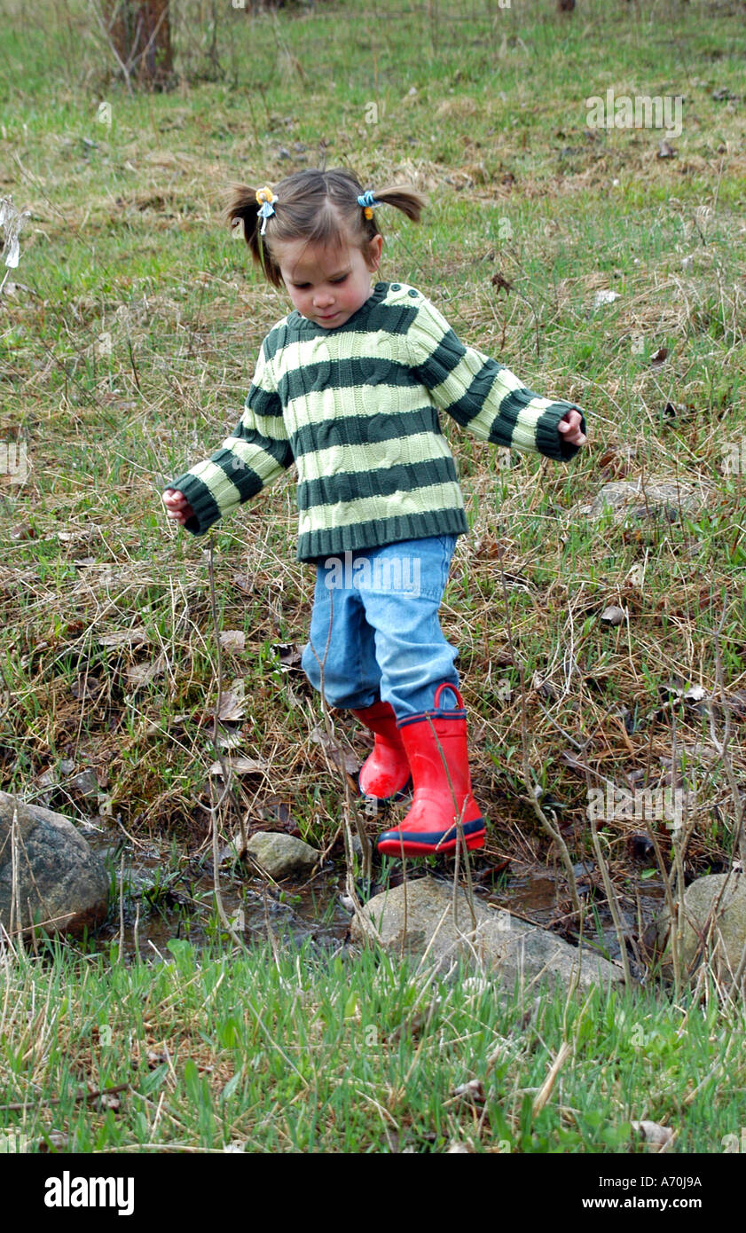 Child crossing bridge Stock Photo - Alamy