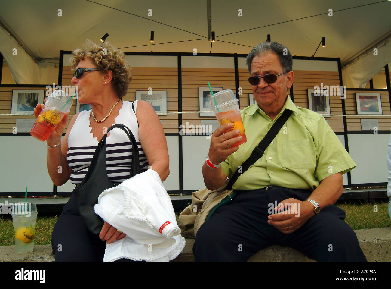 A couple of old people drinking an ice tea during a fair Stock Photo ...