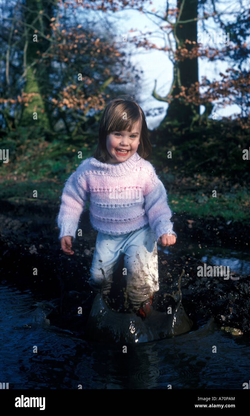 child getting muddy and dirty Stock Photo - Alamy