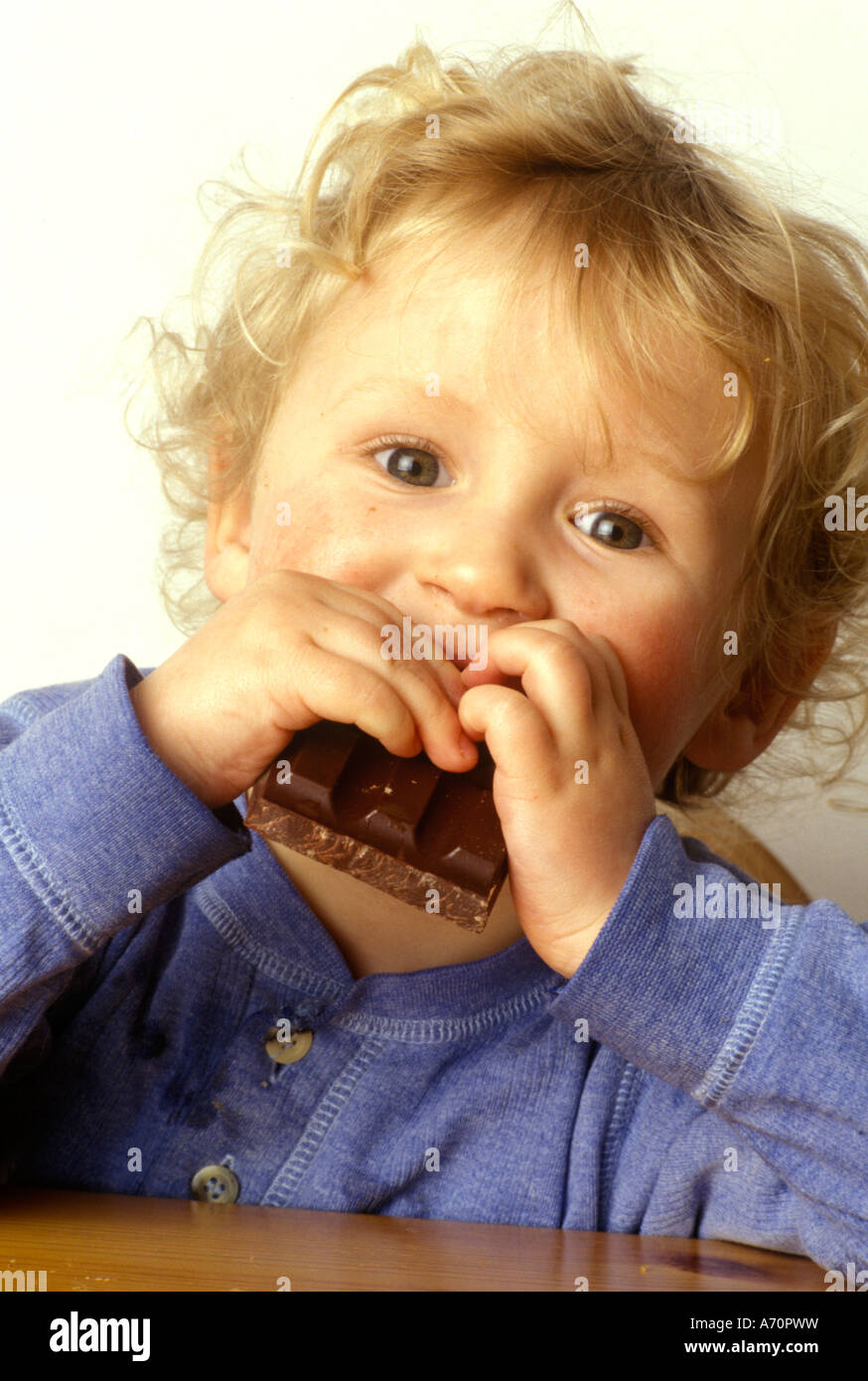 toddler eating dark chocolate Stock Photo - Alamy
