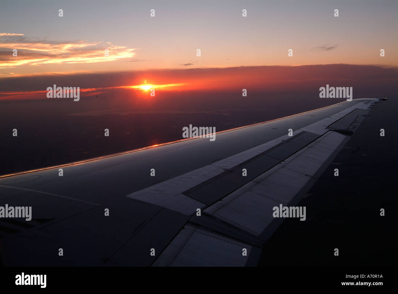 Sunset from a plane window Stock Photo - Alamy