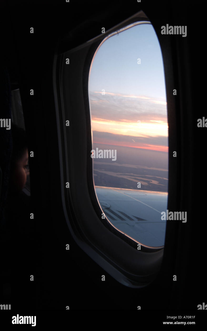 Sunset from a plane window Stock Photo - Alamy