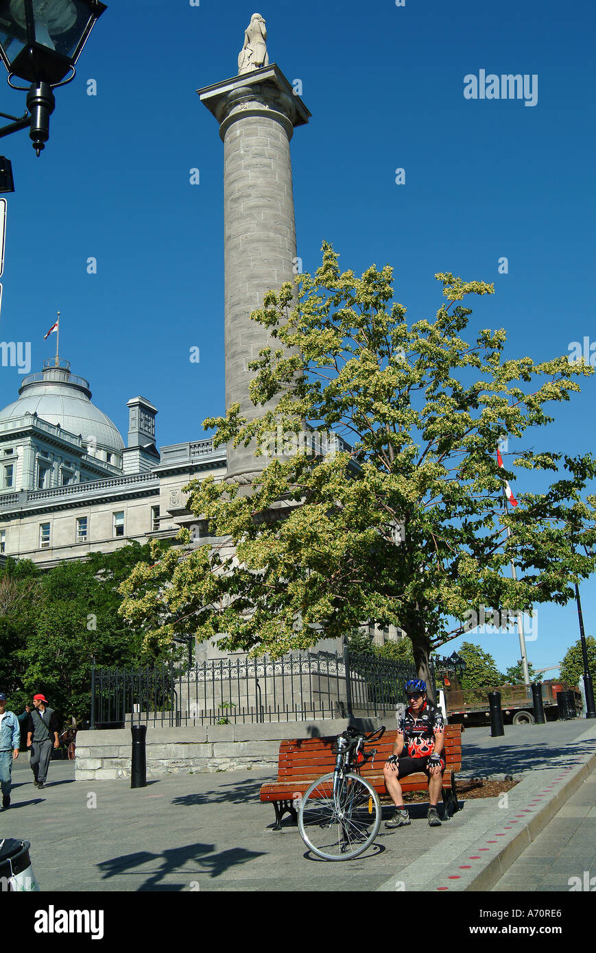 Cyclist resting on a bench in Montreal Quebec Stock Photo - Alamy