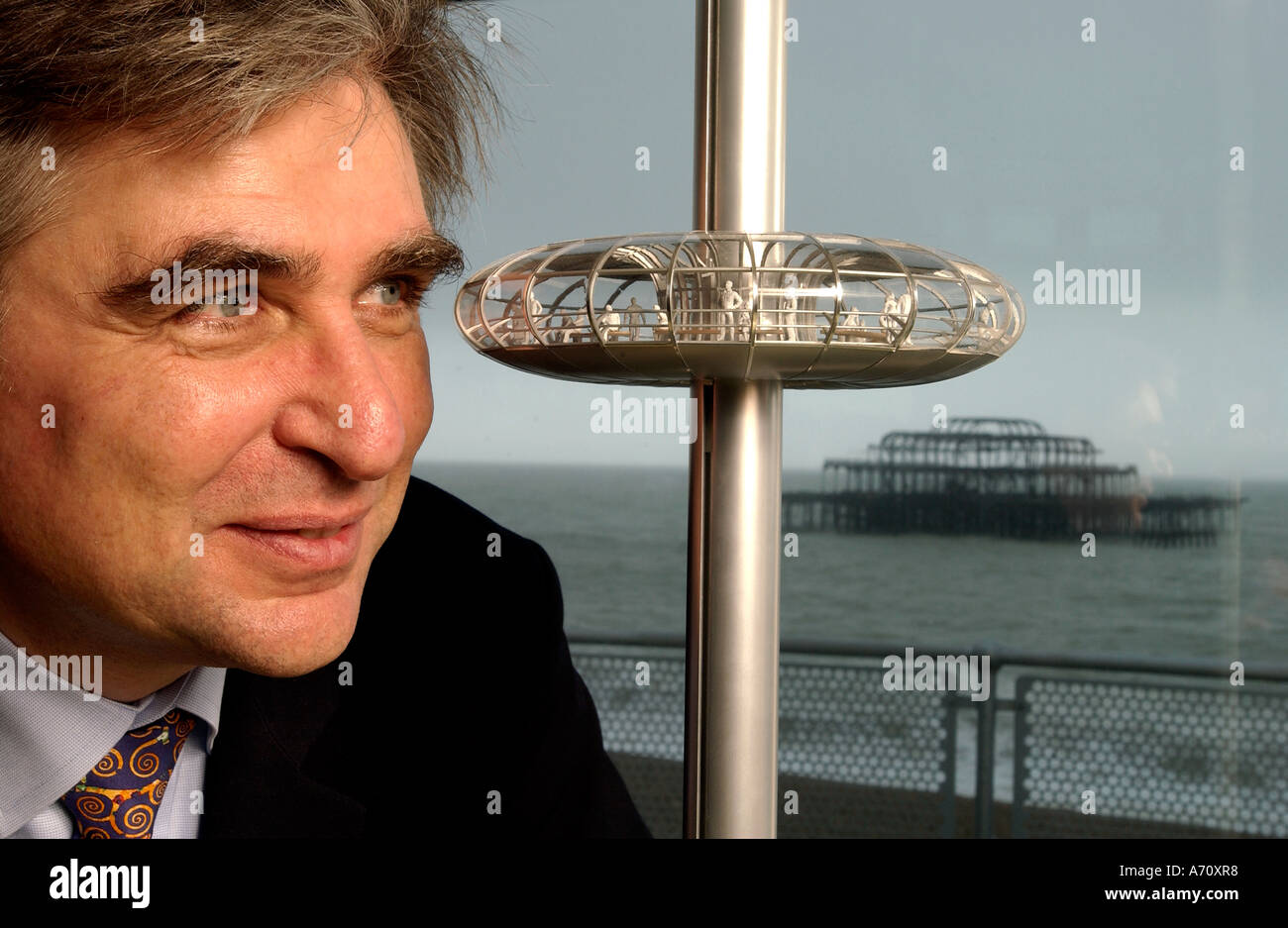 Architect David Marks designer of the London Eye with a model of the ...