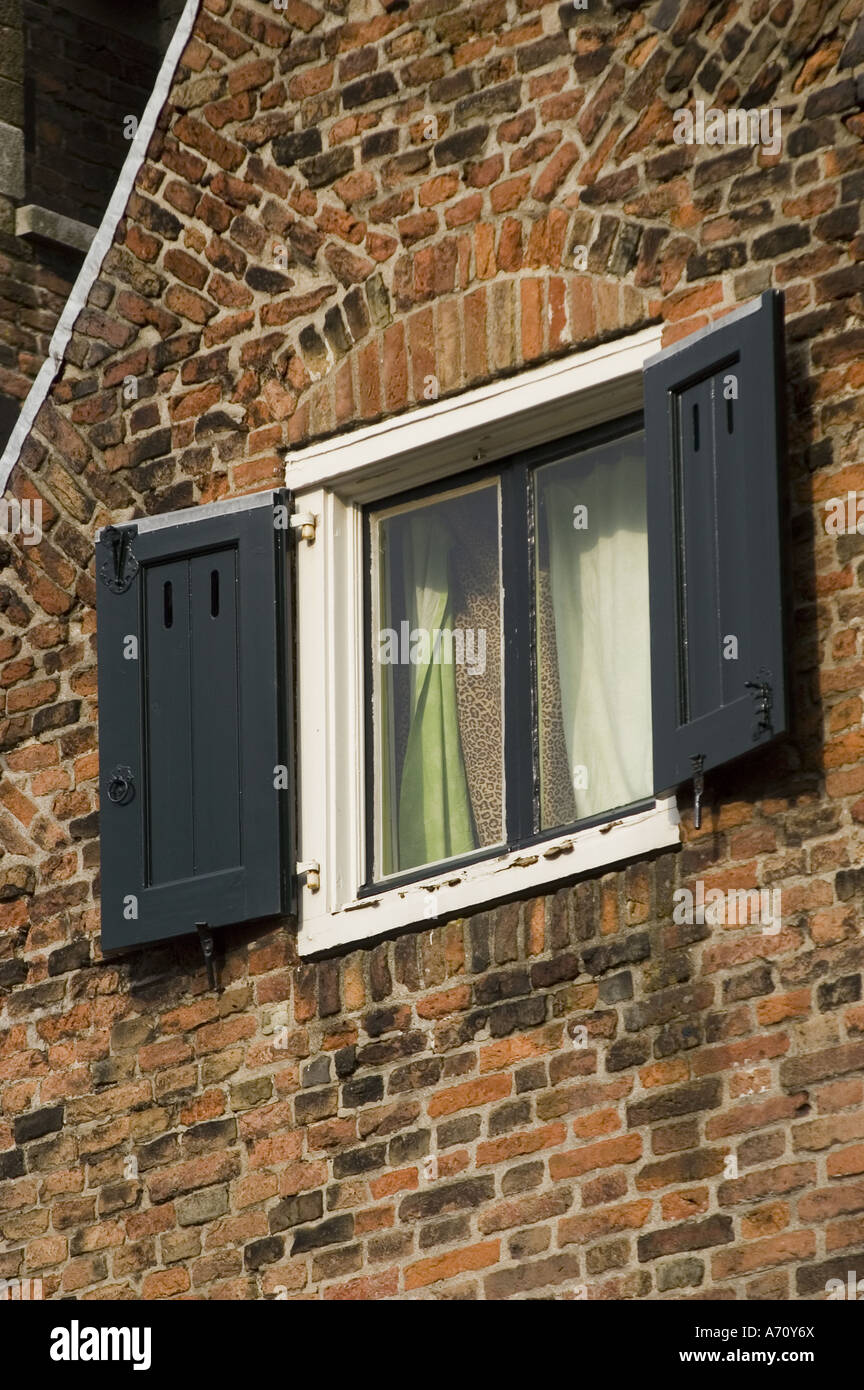 Alone black shutter window with old red brick facade in Utrecht Holland ...