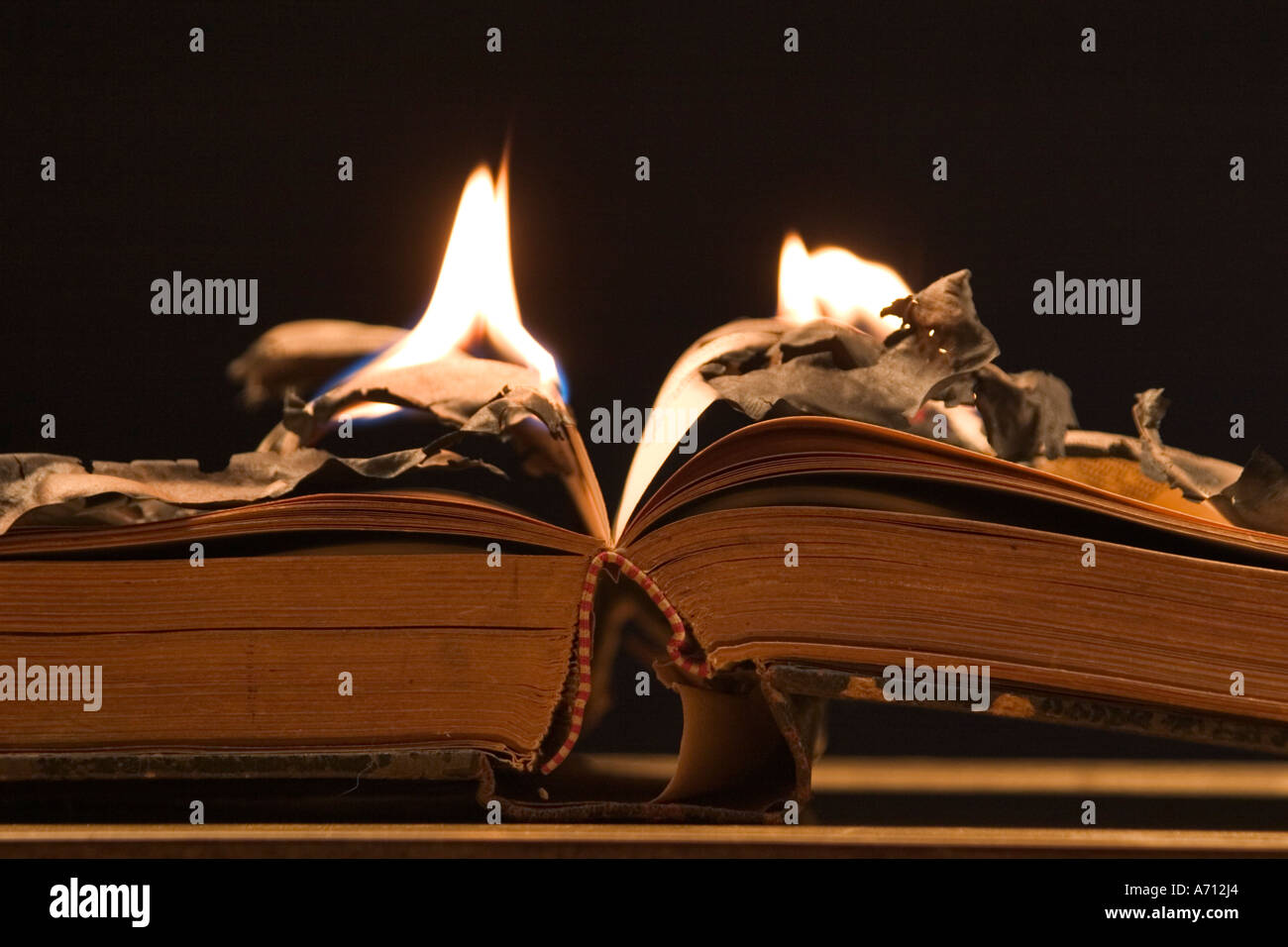 Burning old book Stock Photo - Alamy
