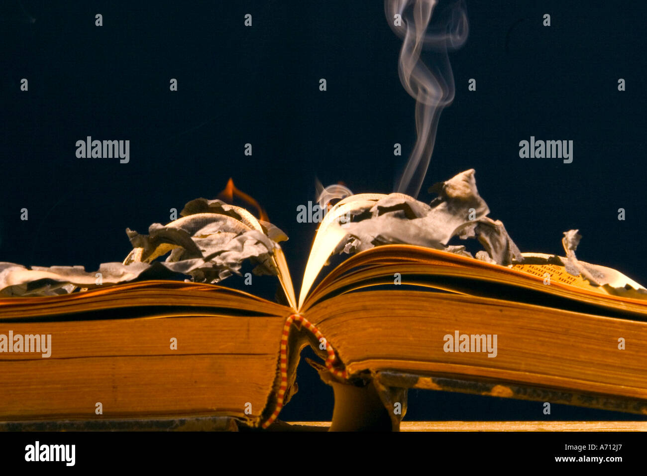 Burning old book Stock Photo - Alamy