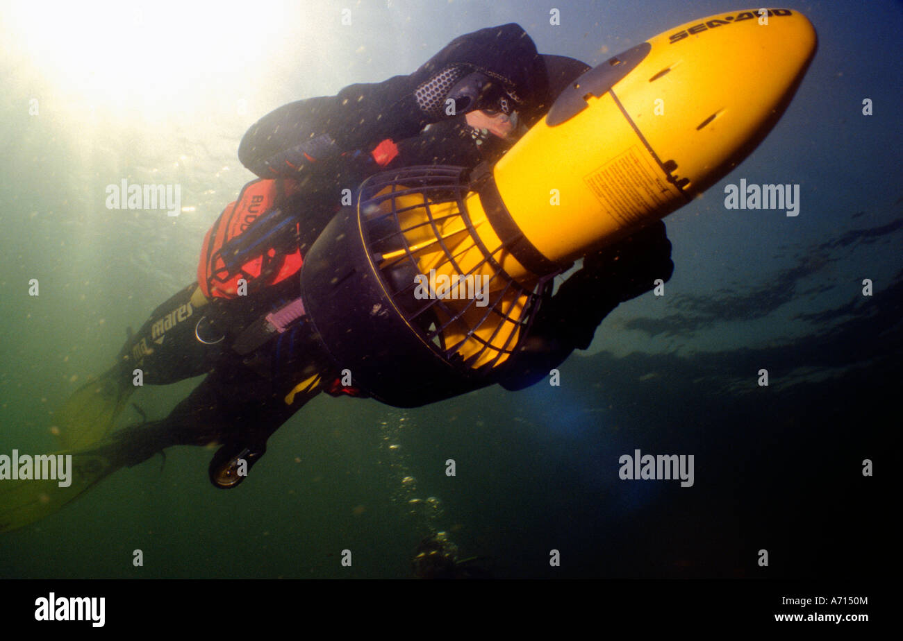 Scuba diver with scooter, UK Stock Photo - Alamy
