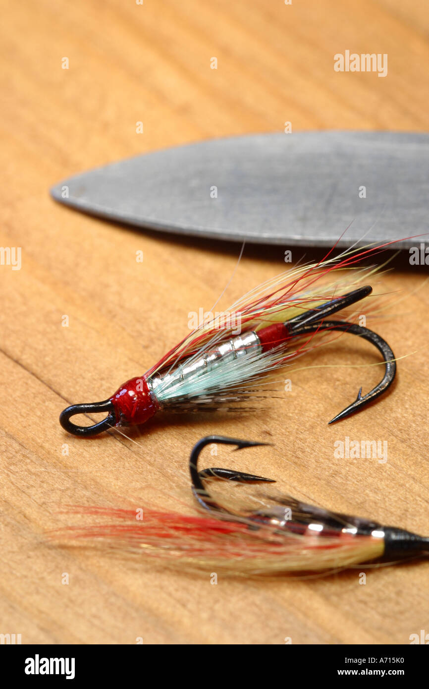 Fly fishing fishing flies hook and knife blade Stock Photo - Alamy