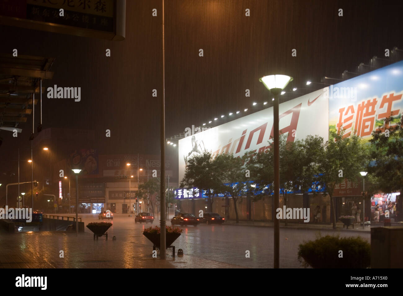 Asia China Beijing Rain storm pours down along downtown street near ...