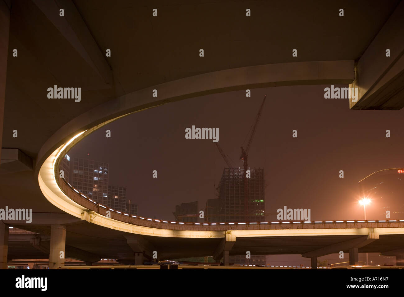 Asia China Beijing Lights of highway overpass and office towers at ...