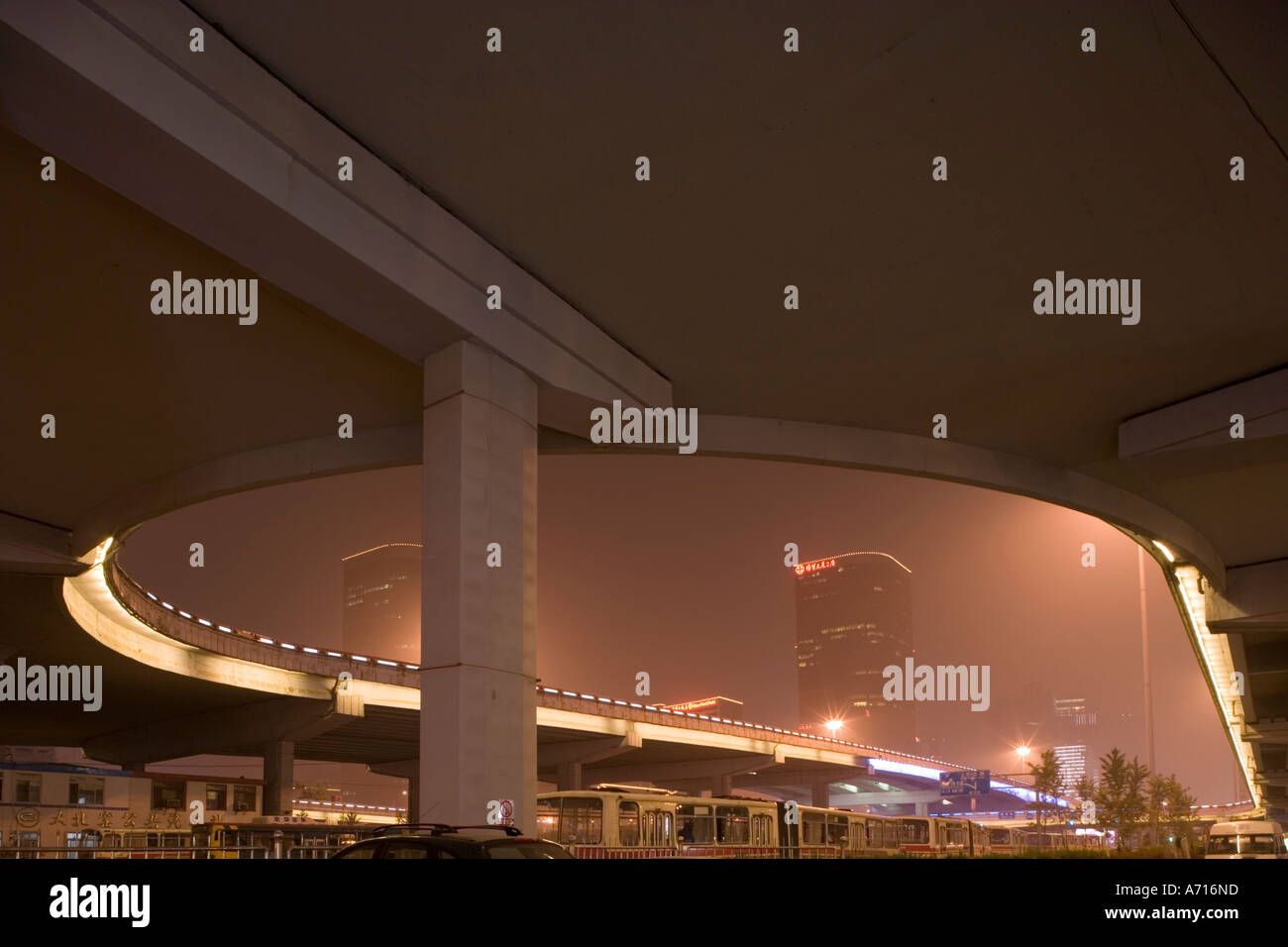 Asia China Beijing Lights of highway overpass and office towers at ...