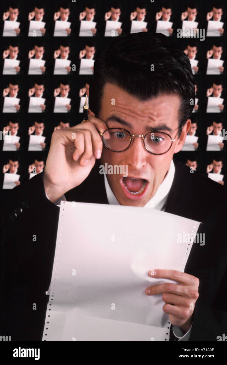 Stressed executive reading document on stressed executives background ...