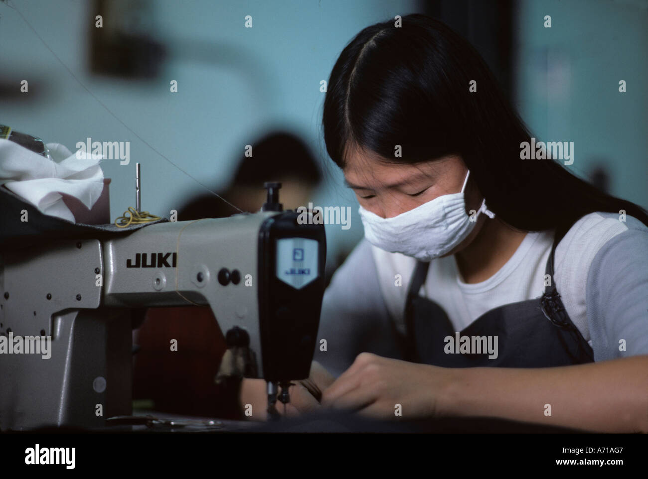 China Hong Kong Woman works in garment sweatshop in New Territories ...