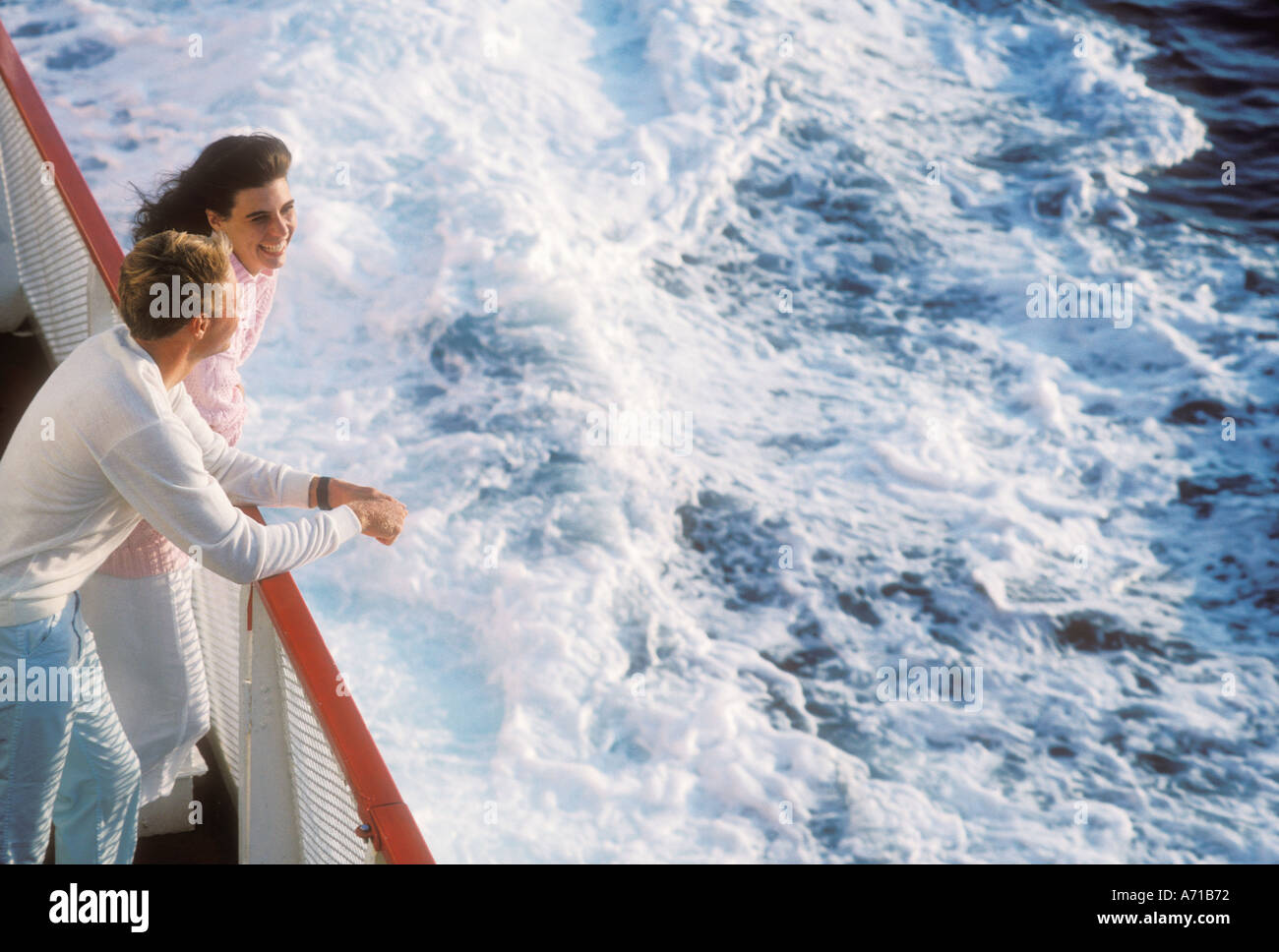 Couple leaning on rail of cruise ship hi-res stock photography and ...