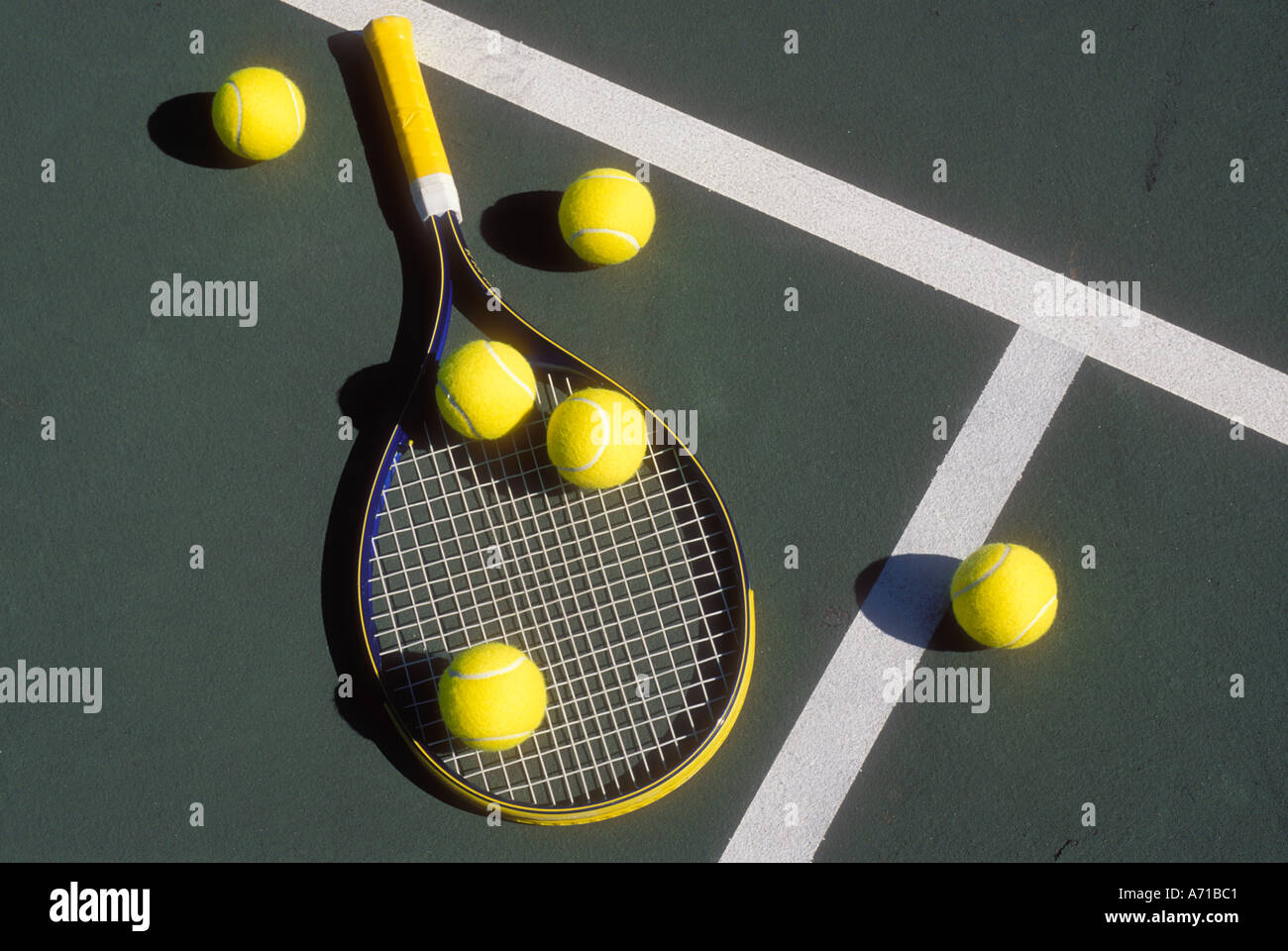 Tennis racket and balls Stock Photo - Alamy