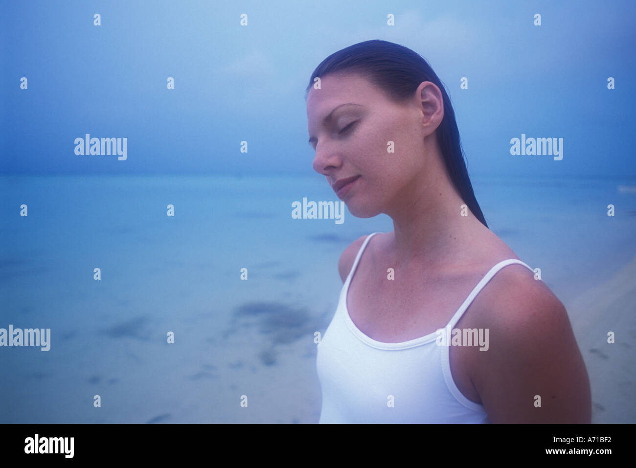 Woman with head tilted and eyes closed Aitutaki Lagoon Cook Islands ...