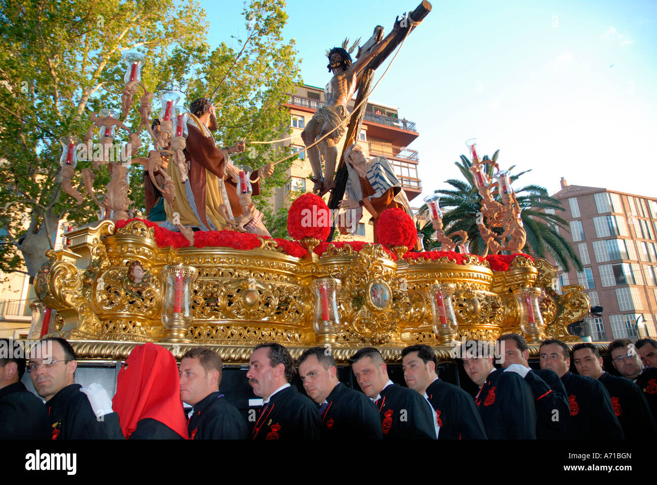 Lifesize figure of Christ on gilded throne carried through streets of ...