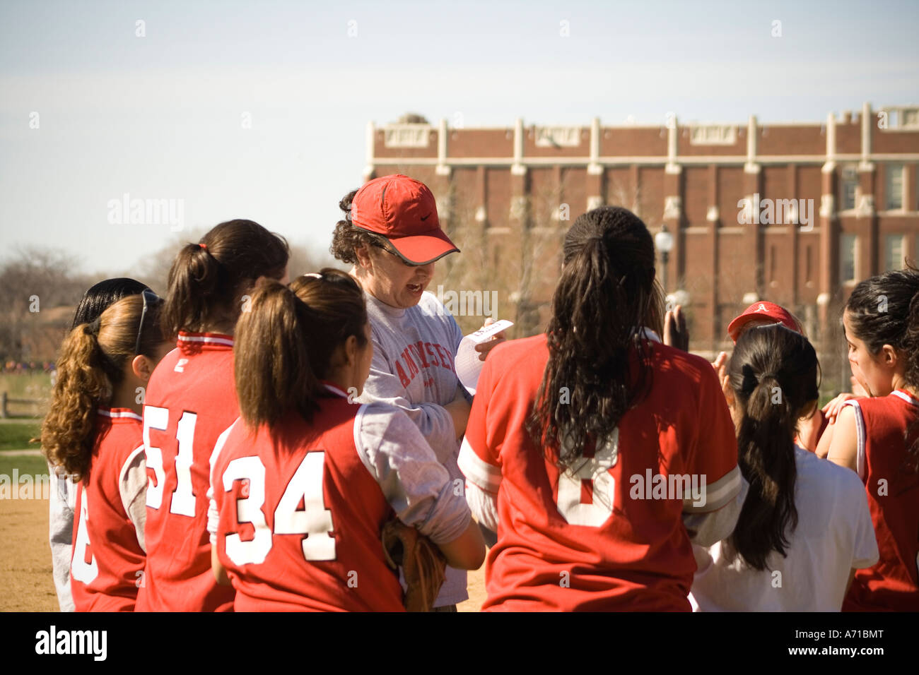High school coach giving a pep talk to a girls softball team Chicago ...