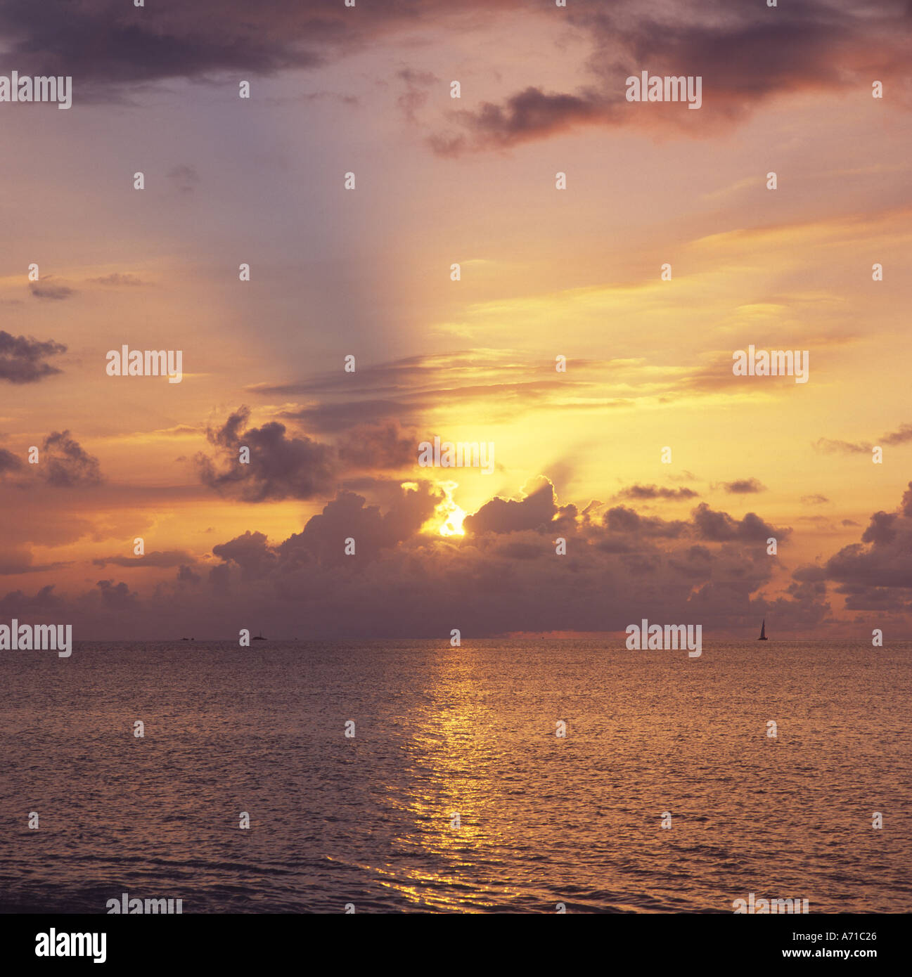 Grey clouds over tropical island hi-res stock photography and images ...
