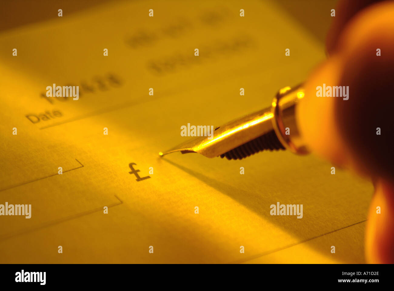 pen nib completing sterling cheque Stock Photo - Alamy