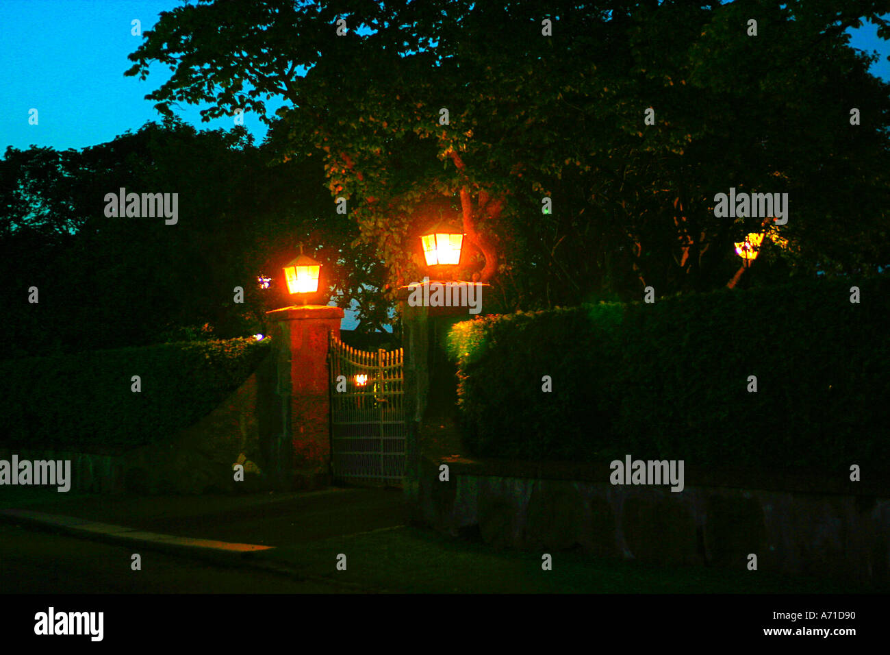 Lights at garden gate Stock Photo - Alamy