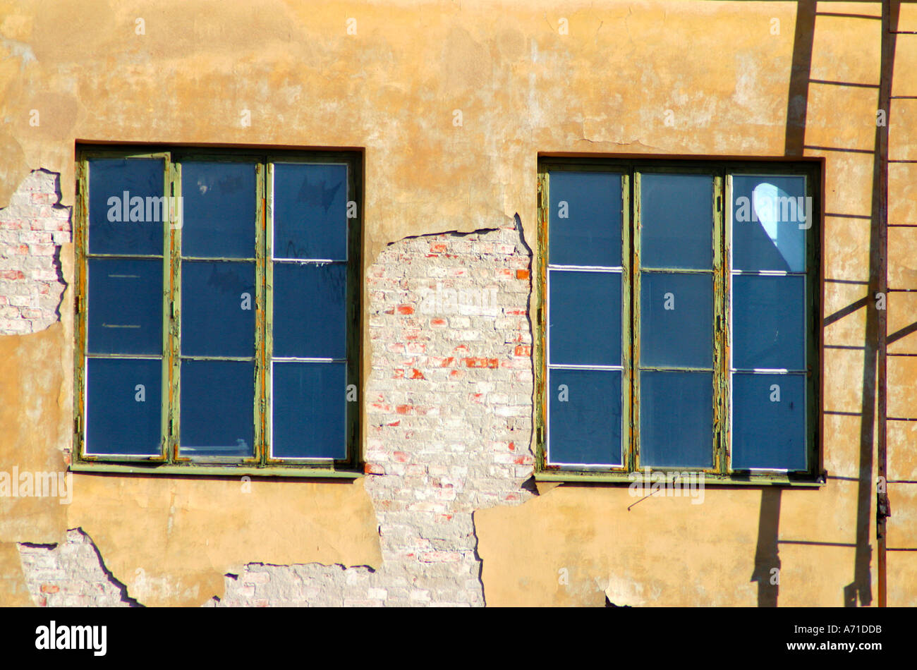 Windows of old worn house Stock Photo - Alamy